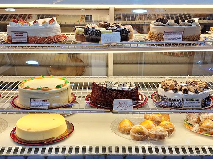 The dessert case – where willpower goes to die and celebrations find their sweet finale. These cakes aren't just desserts; they're edible exclamation points.