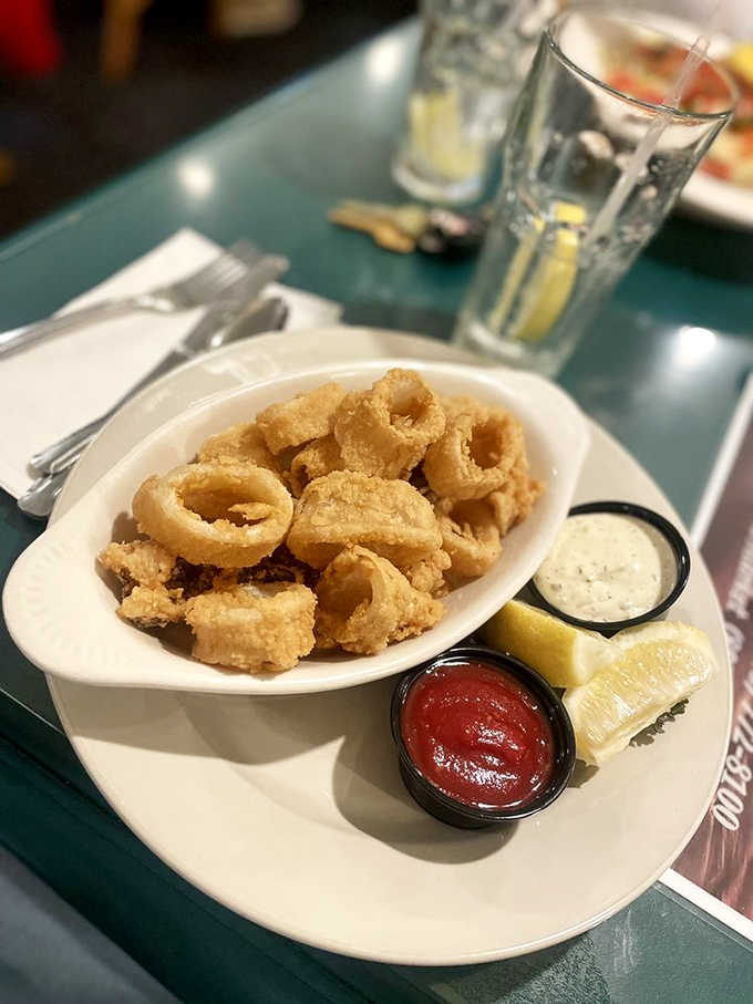 Calamari so perfectly golden and crispy, it converts even the most skeptical seafood newcomers. Two dipping sauces because life is about choices.