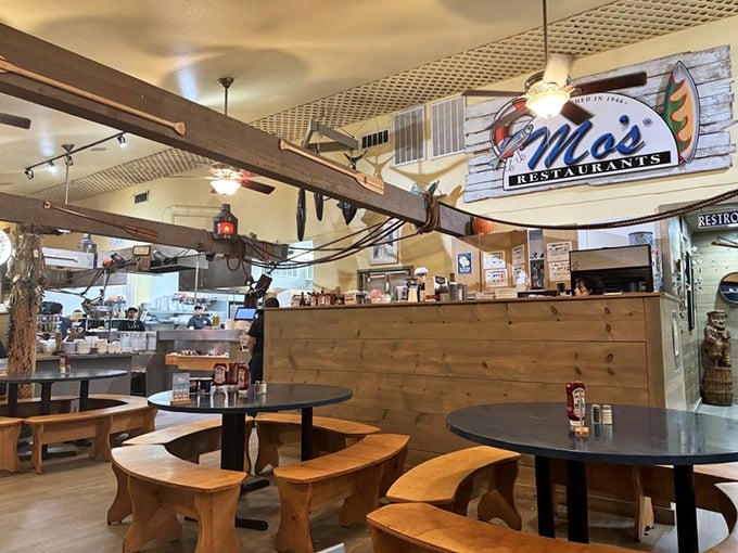 Where the magic happens—Mo's open kitchen and order counter. The wooden paneling and nautical decor remind you that seafood this fresh deserves a proper coastal setting.