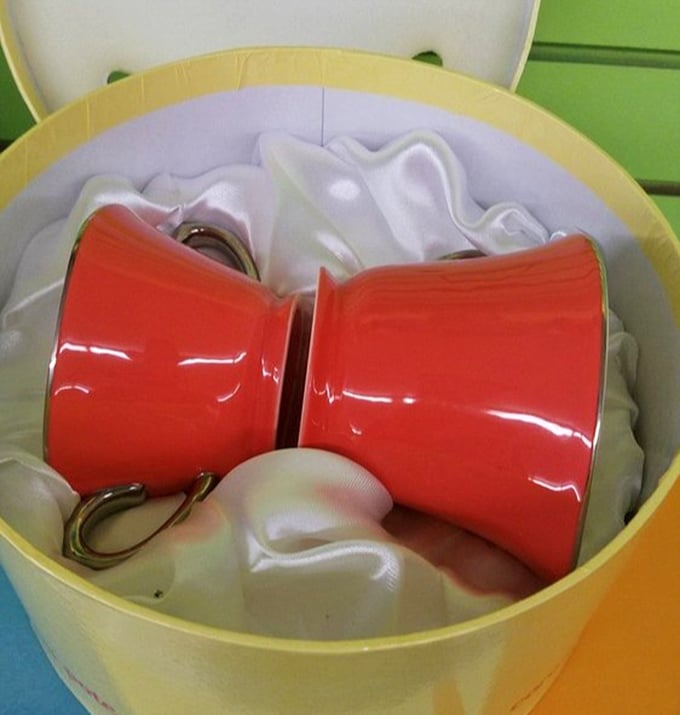 Those cheerful red mugs aren't just containers for coffee—they're future vessels for morning inspiration at a fraction of retail prices.