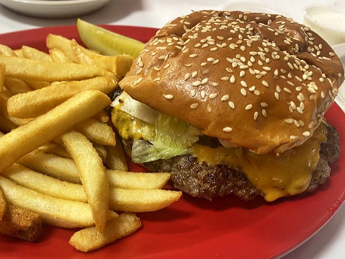 A proper cheeseburger doesn't need fancy tricks—just quality beef, melty cheese, fresh toppings, and a bun that knows its supporting role.