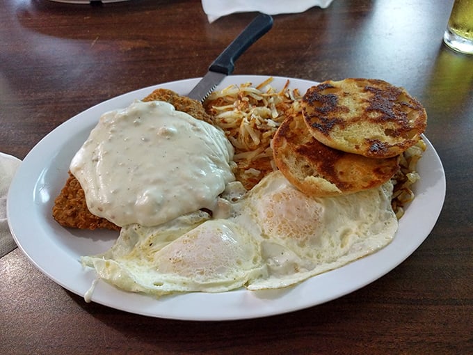 Chicken fried steak smothered in gravy with a side of pancakes—because sometimes you need to embrace the beautiful marriage of breakfast and dinner.
