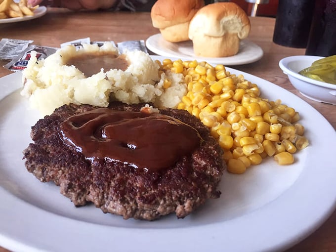 The classic chopped steak platter—when your stomach demands substance and your soul craves comfort. Those mashed potatoes aren't just a side, they're a statement.