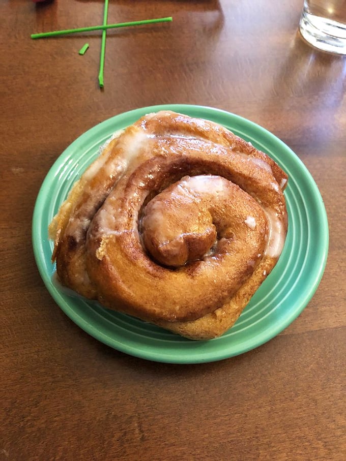 This cinnamon roll isn't just breakfast—it's an edible hug, swirled with cinnamon and glazed with enough sweetness to justify morning dessert.