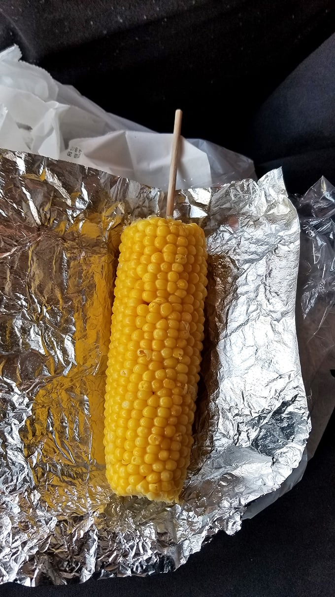 Corn on the cob—nature's handle-equipped side dish. Simple, sweet, and the perfect way to pretend you're eating something healthy with your fried feast.