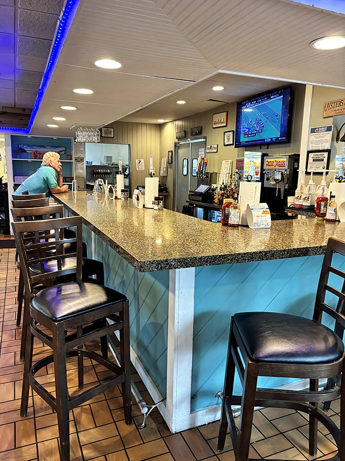 The bar area – where sports on TV and cold drinks create that perfect "I could stay here all afternoon" kind of vibe.