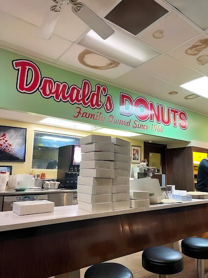 Behind this counter, donut artisans work their magic with flour, oil, and decades of experience.