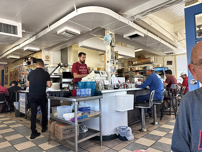 The heart of Frank's operation—where orders are called, coffee is poured, and morning miracles are dispatched with efficiency.