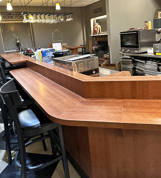 The wooden bar where coffee dreams come true. That "Don't Wish For It, Work For It" sign isn't just décor—it's the café's unofficial mantra.