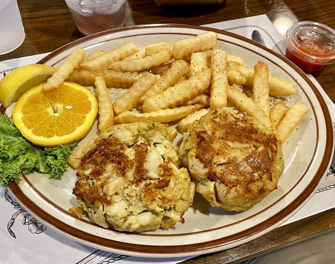 The holy grail of Maryland cuisine—two perfectly broiled crab cakes with minimal filler and maximum flavor, worth every mile of the journey.