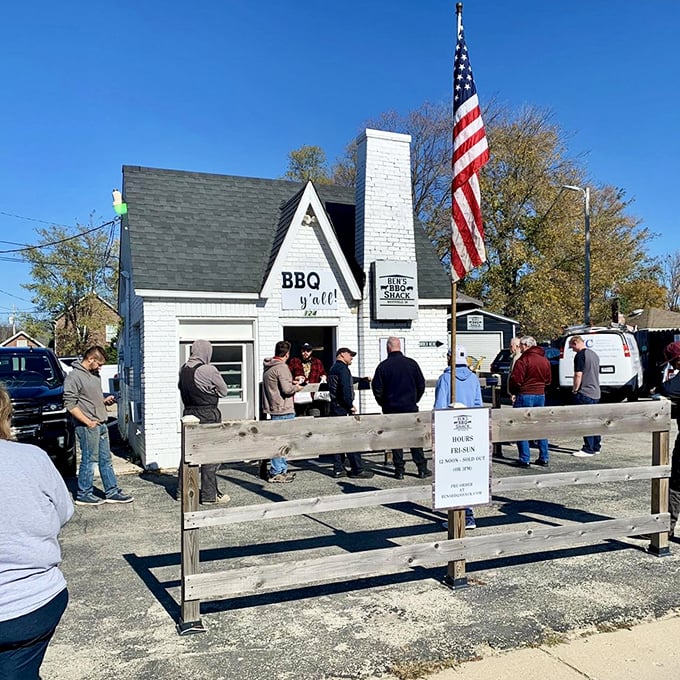 The line forms early at Ben's—a testament to barbecue worth waiting for. That American flag adds a perfect touch of heartland pride.