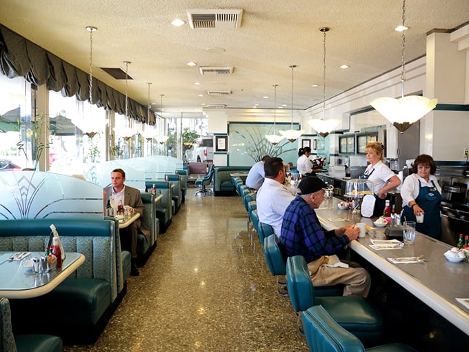 Where strangers become neighbors over coffee and conversation. The buzz of diner life is a symphony of clinking silverware and laughter.