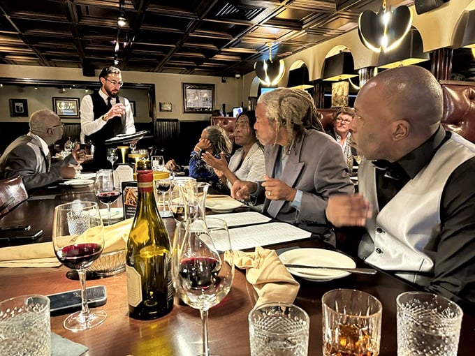 Happy diners sharing stories and steaks, proving good food creates the best kind of dinner theater.