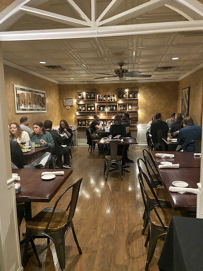 A dining room filled with happy patrons experiencing the universal language of "mmm" - no translation necessary when the food is this good.