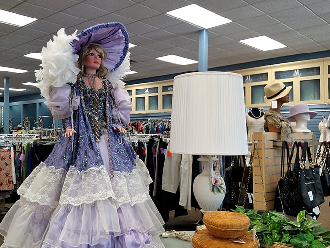 Another elaborate doll holds court in purple majesty. She's not just wearing a dress—she's wearing an entire royal backstory.
