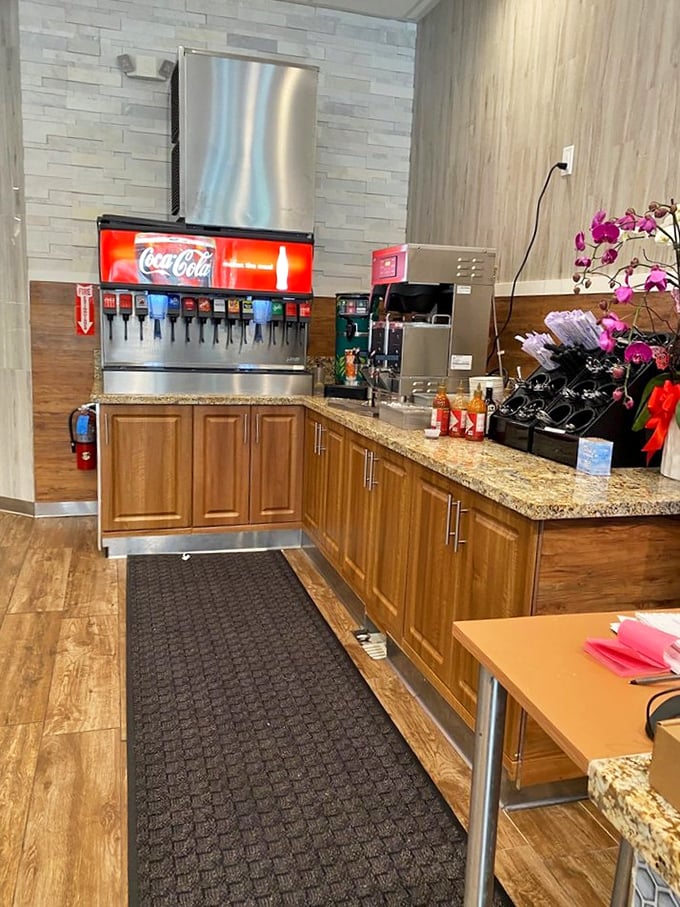 The self-serve beverage station—an oasis where unlimited refills remind us that sometimes the simple pleasures in life actually are free (with purchase).