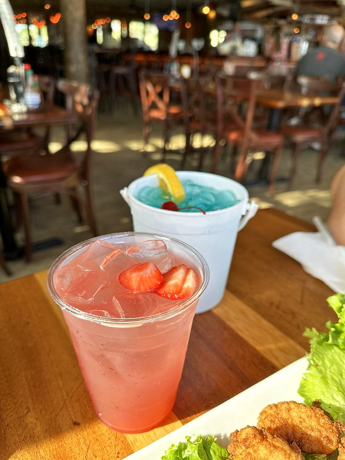 Cocktails that match the view—vibrant, refreshing, and making you forget you have responsibilities back home. That blue drink is basically liquid vacation.