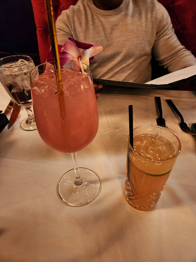 Cocktails that dress better than most people. That pink beauty isn't just a drink – it's a conversation starter with a flower crown.