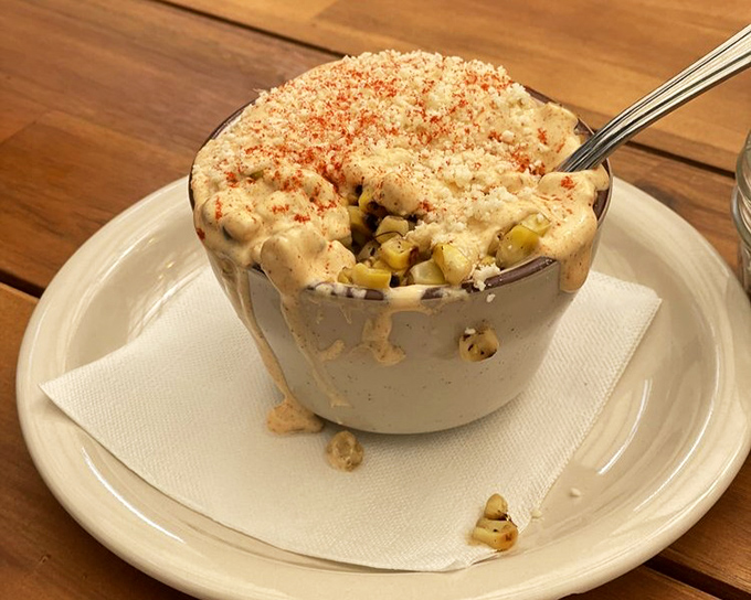 Elote in a cup with a side of comfort—proof that sometimes the simplest dishes deliver the most complex flavors.