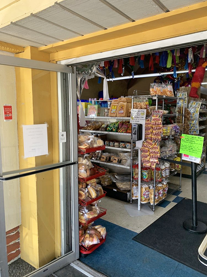 The entrance beckons with promises of carb-laden bliss. Those red baskets of bread aren't just baked goods—they're your first clue that diet plans come here to die.