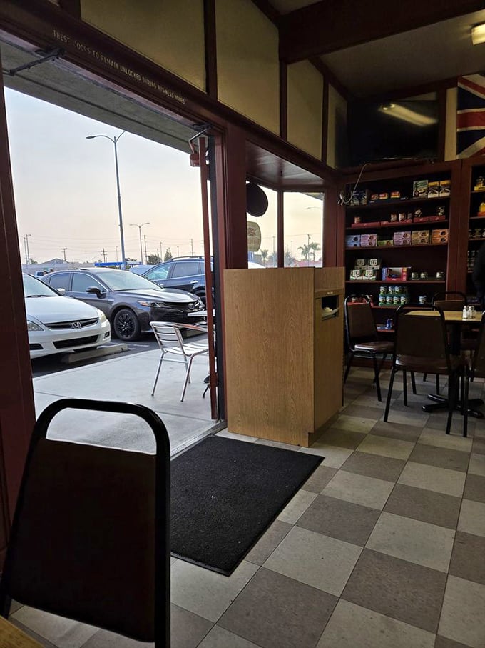 The view from inside offers a glimpse of California sunshine—the perfect contrast to the British comfort food experience waiting at your table.