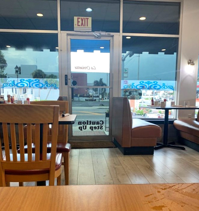 That "Step Up" sign on the door isn't just an instruction—it's your first clue that you're entering somewhere a cut above ordinary breakfast joints.