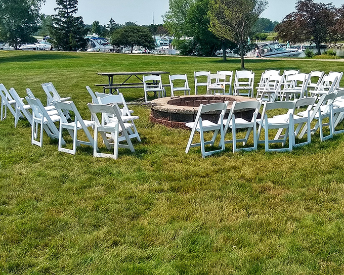 White chairs circle the fire pit like modern-day Stonehenge—a sacred space for gathering, celebrating, and perfectly toasted s'mores. 