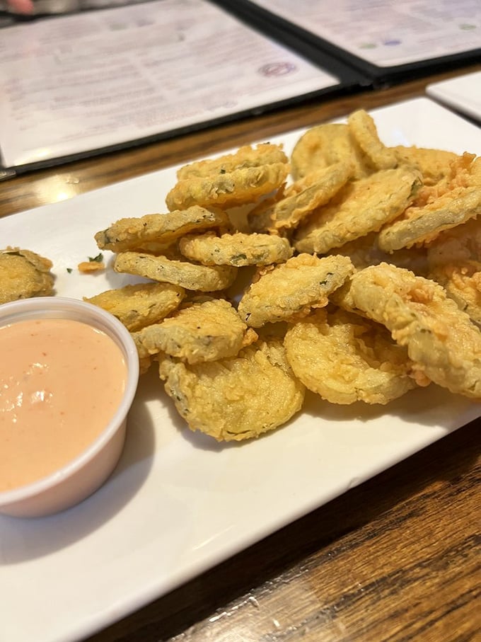 Fried pickles with that addictive dipping sauce—the appetizer that makes you wonder why you waited so long to try them and why you'd order anything else.