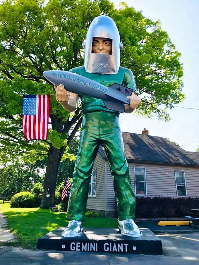 Up close, the Gemini Giant's expression suggests he's seen things – mostly decades of Illinois weather and tourist selfies.