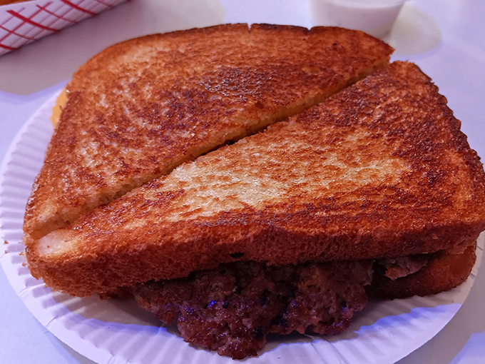 The grilled cheese sandwich—golden-brown perfection that reminds you why this childhood classic deserves a permanent place in adult dining.