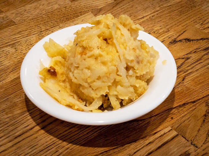 This isn't just hashbrown casserole – it's a golden mountain of potato perfection that makes an excellent foundation for any breakfast adventure.
