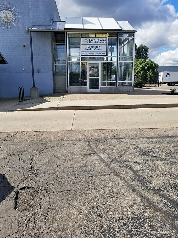 Beyond bargains, the complex houses community services. This health center entrance reminds us that St. Vincent de Paul's mission extends far beyond retail therapy.