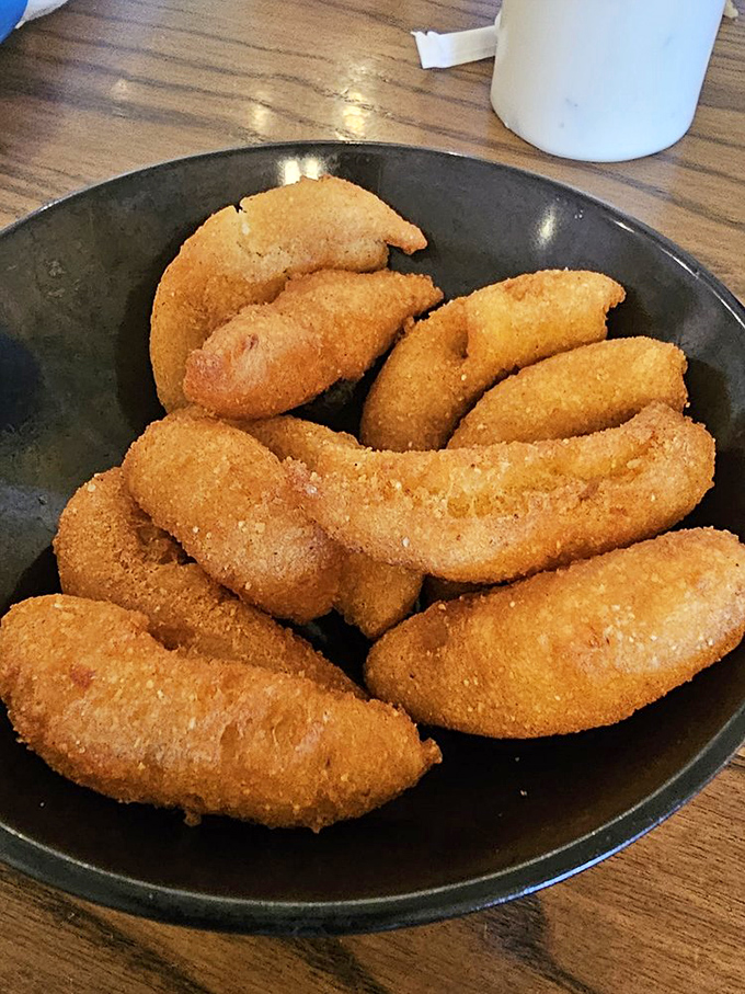 Hush puppies so perfectly golden they deserve their own trophy. Crispy outside, tender inside—the unsung heroes of seafood dining.