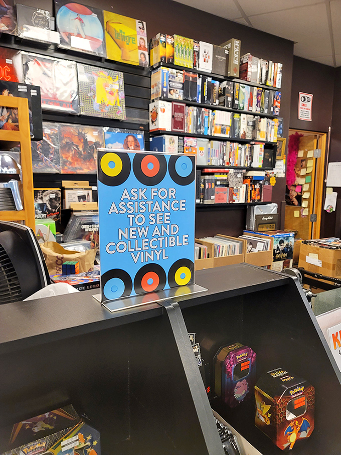 "Ask for assistance to see collectible vinyl"—because some treasures, like the best stories, require a guide to fully appreciate.