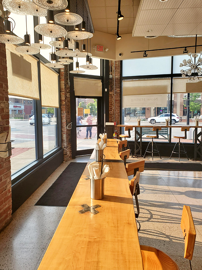 Those chandeliers aren't just pretty - they're lighting the way to your next favorite meal like culinary lighthouses.