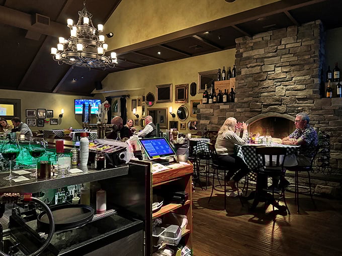 The bar area combines rustic stone, warm lighting, and the promise that whatever's troubling you can wait until after dinner.