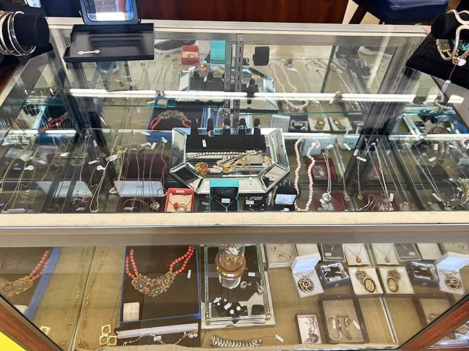 The jewelry counter – where one person's forgotten treasure becomes another's conversation starter. That coral necklace is practically screaming "beach vacation outfit!"