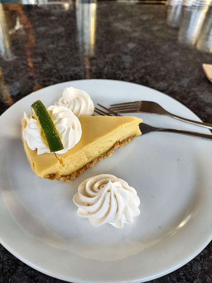 Key lime pie that strikes that perfect balance between sweet and tart—topped with whipped cream swirls and a lime slice for that Instagram-worthy finish.