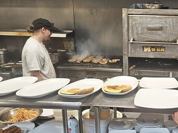 A glimpse into the kitchen where the magic happens – that "Go Blue" sign suggesting even Michigan fans are welcome if they appreciate good food.