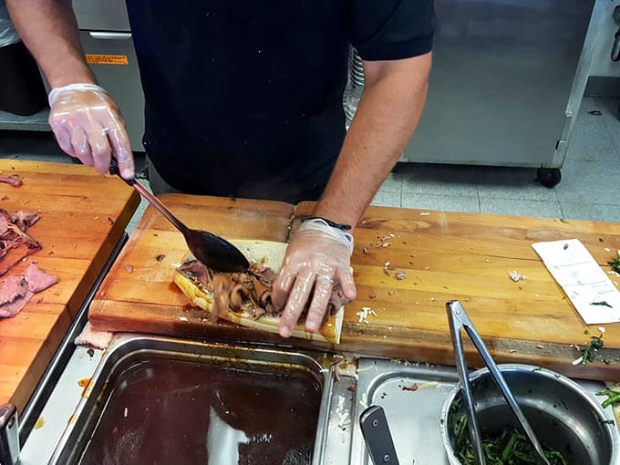 Behind the scenes where the magic happens. Fresh ingredients transform into legendary sandwiches under skilled hands.
