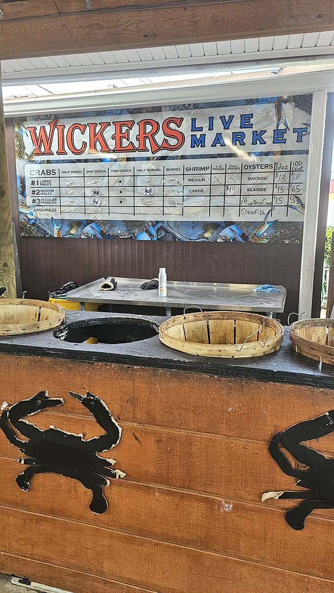 The live market price board—where seafood economics meet deliciousness. Those wooden baskets below are about to make someone very happy.