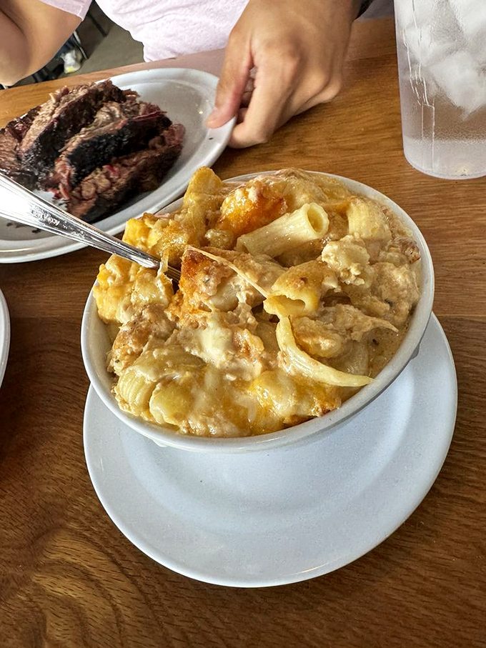 This isn't your childhood mac and cheese—it's a creamy, bubbling masterpiece that demands equal billing with the starring meats.