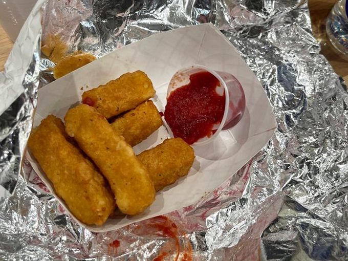 Mozzarella sticks that stretch for dramatic effect with each bite. That marinara sauce isn't just a dip—it's a perfect dance partner.
