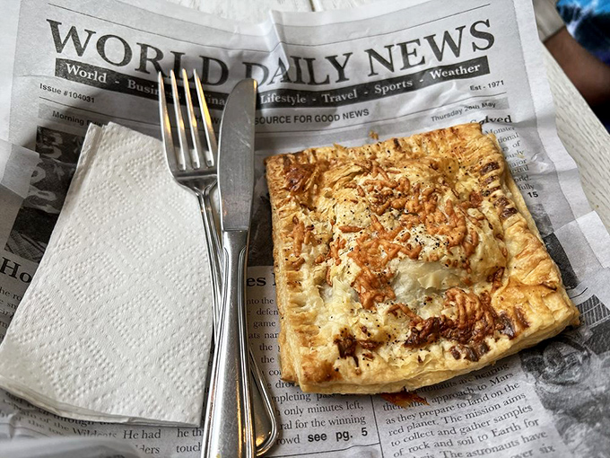This savory hand pie doesn't need utensils—just an appetite and the willingness to temporarily abandon your diet plans.