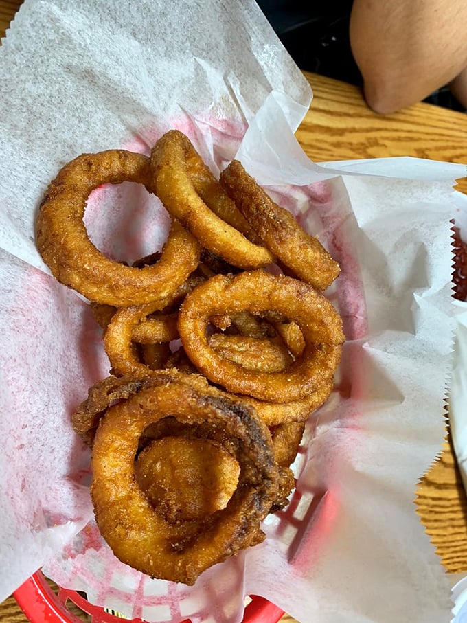 Onion rings wearing their golden jackets proudly—crispy, light, and ready to complement that barbecue.