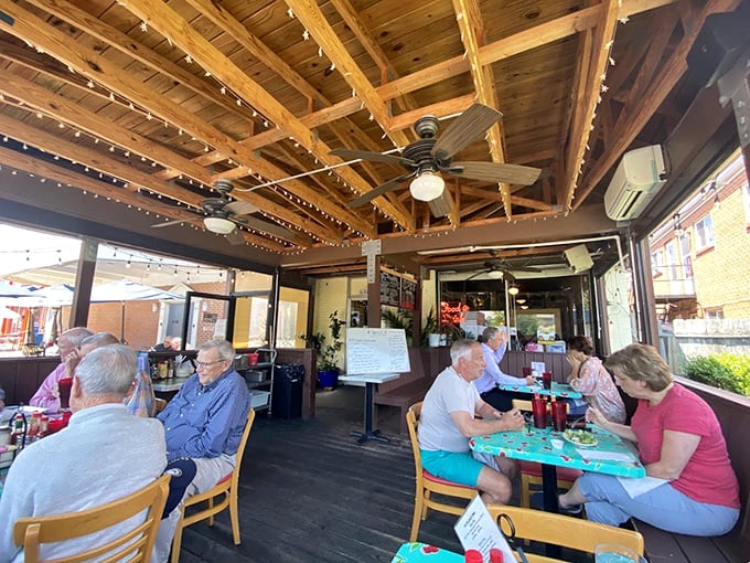 Outdoor dining at its most charming—wooden beams, string lights, and tables filled with locals who know they've found Richmond's best-kept secret.