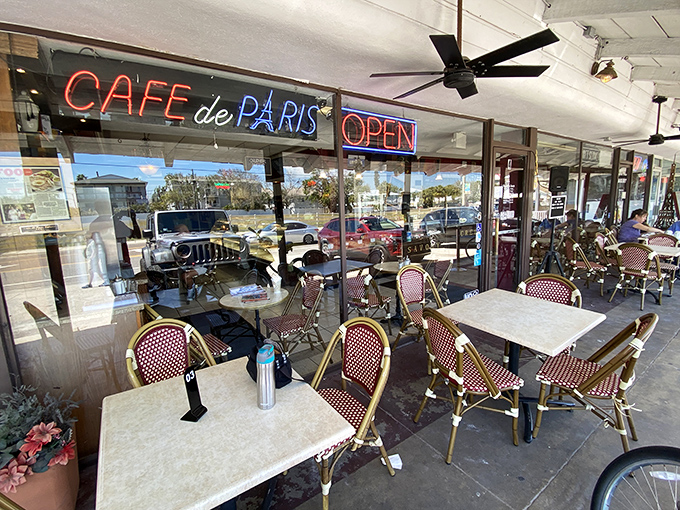 The outdoor seating area—where Florida sunshine meets French café culture. Perfect for people-watching with your cappuccino.