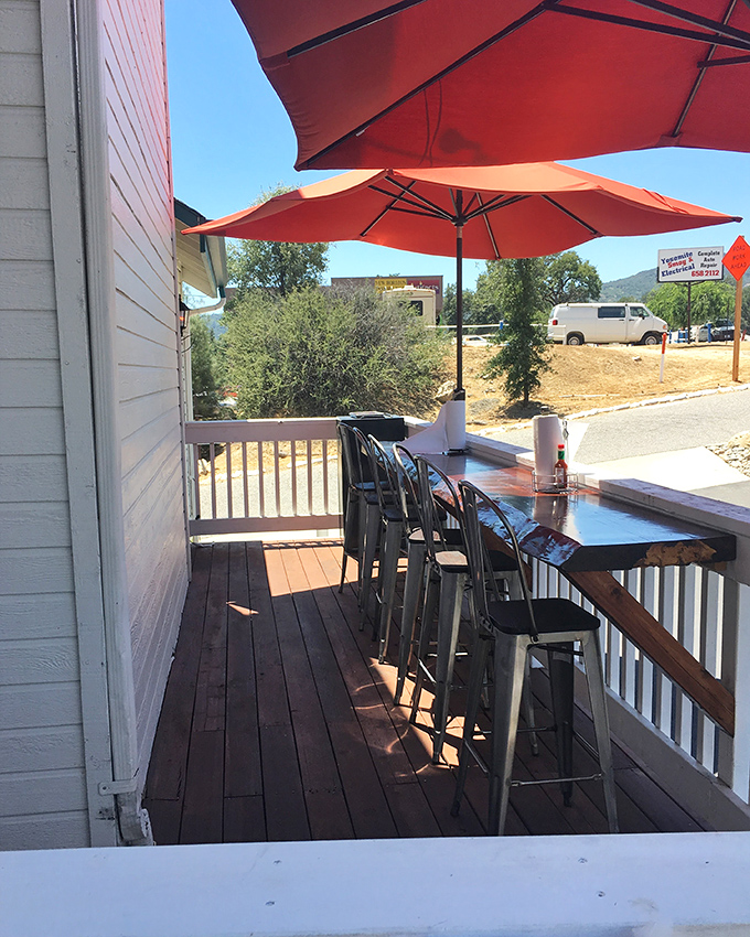 Outdoor seating with mountain views and fresh air—nature's perfect palate cleanser between bites of heavenly BBQ.