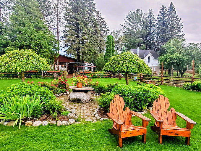 Adirondack chairs beckon in a garden that's both meticulously planned and perfectly relaxed—nature's waiting room before the main culinary event.