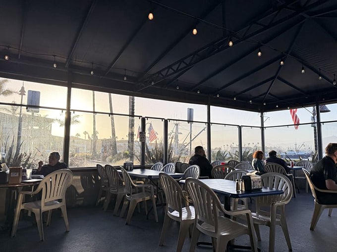 Patio dining with harbor views – where sea breezes enhance every bite you take.